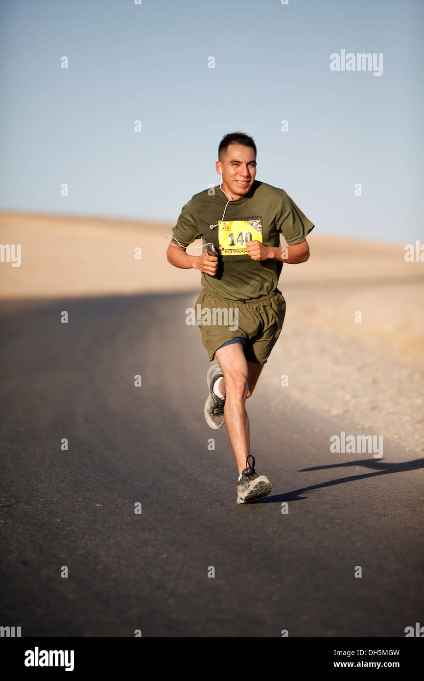 Runners compete in the 2013 Marine Corps Marathon Fowrard at Camp ...
