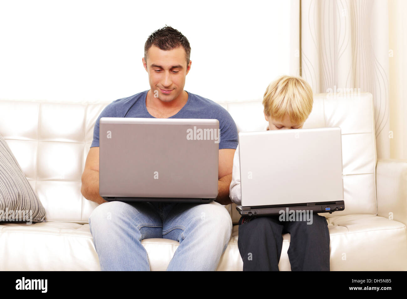 Father and son with computers hi-res stock photography and images - Alamy
