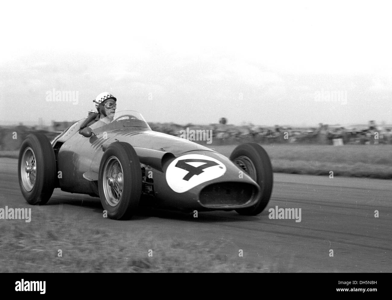Jean Behra in a factory Maserati Lightweight 250F at the British Grand ...