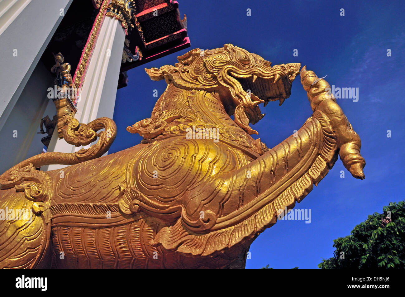 Entrance with golden guardian figures hi-res stock photography and ...