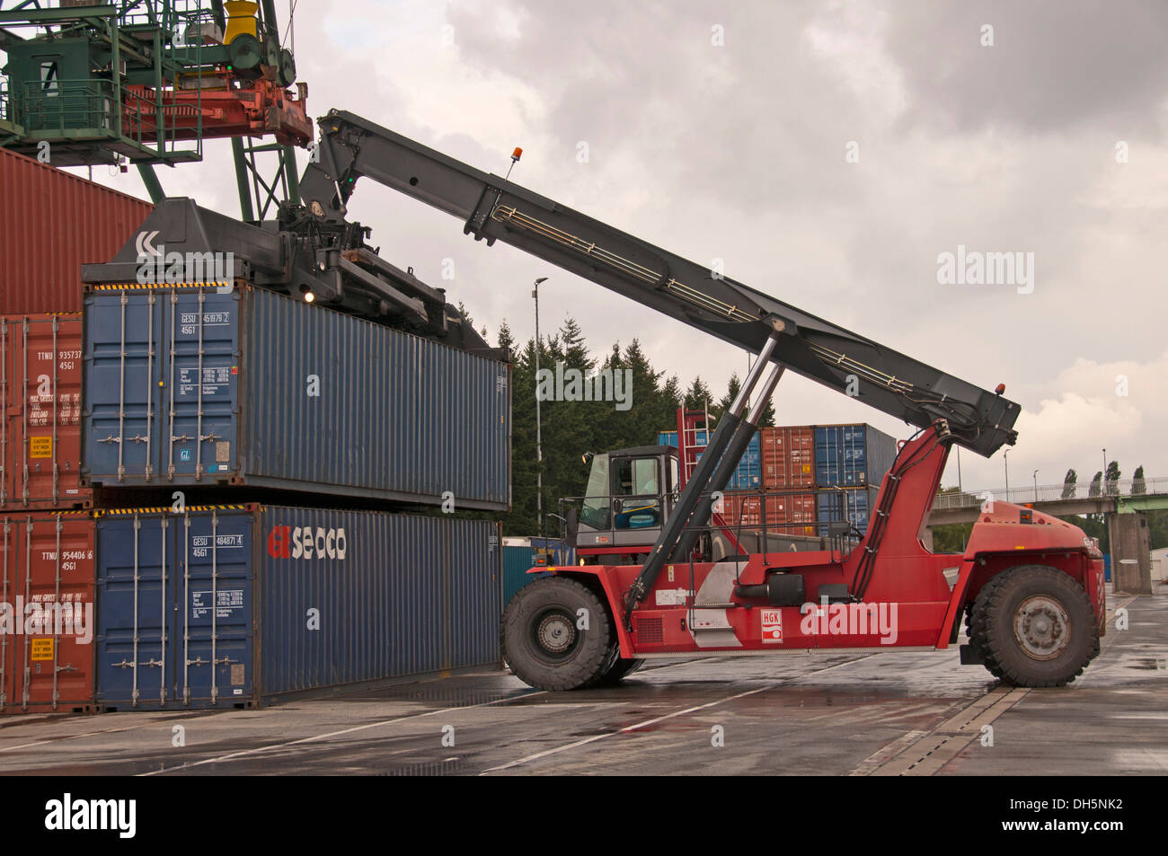 Container terminal, Kalmar-spreader handling containers delivered by ...
