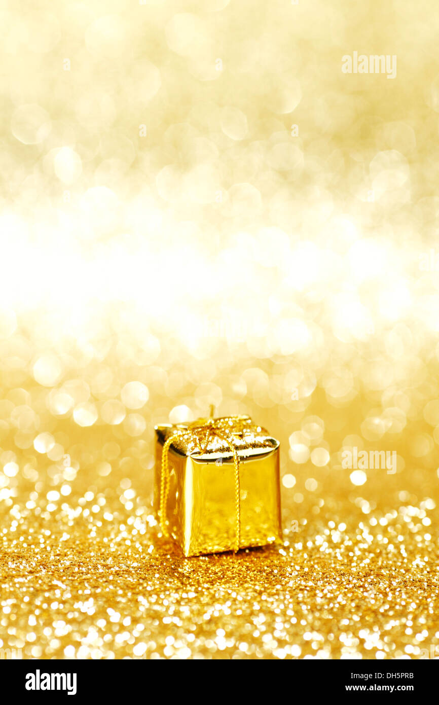 Golden box with christmas gifts on shiny glitter background Stock Photo ...