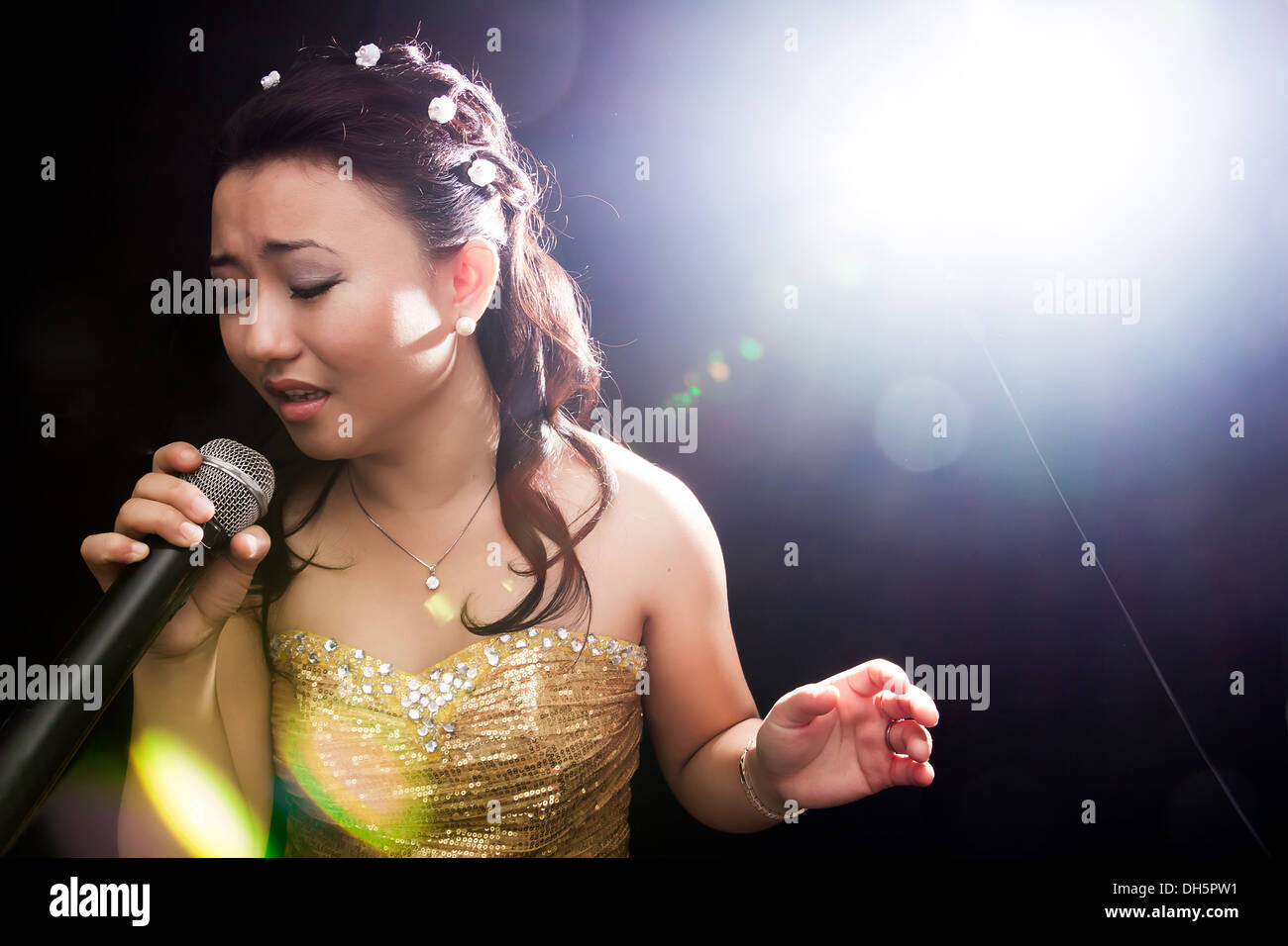 Concert young Asian singer of the girl Stock Photo - Alamy