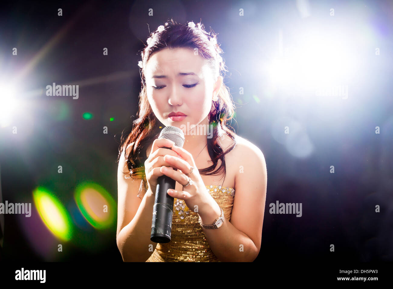 Concert young Asian singer of the girl Stock Photo - Alamy