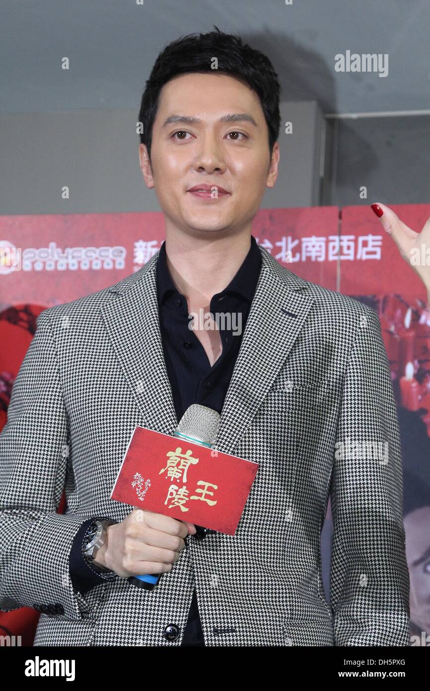 Taipei, China. 31st Oct, 2013. Actor Feng Shaofeng shows the costume he ...