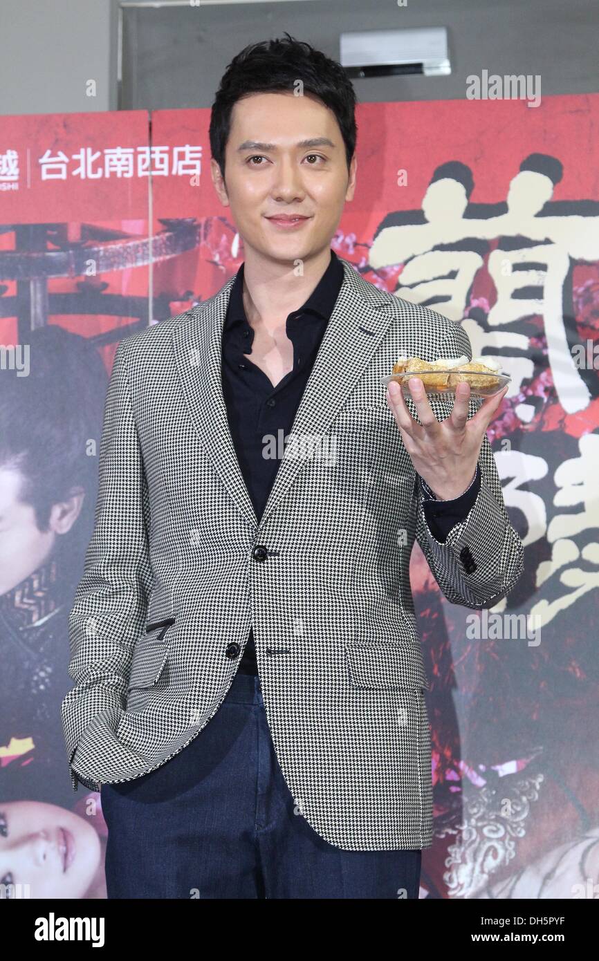 Taipei, China. 31st Oct, 2013. Actor Feng Shaofeng shows the costume he ...