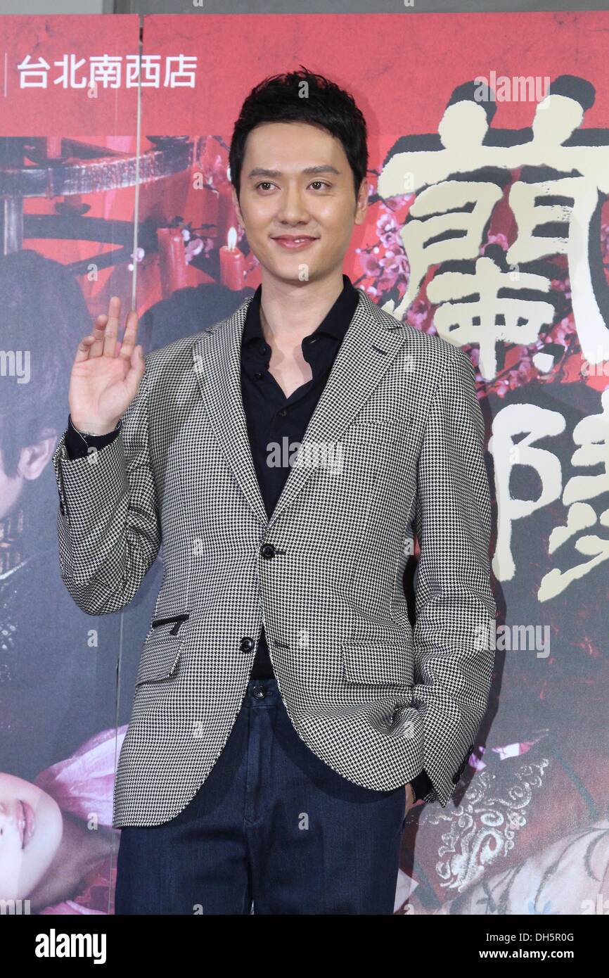 Taipei, China. 31st Oct, 2013. Actor Feng Shaofeng shows the costume he ...