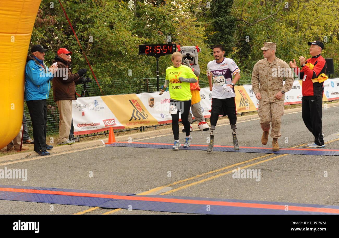 A participant crosses the finish line of the 38th Annual Marine Corps ...