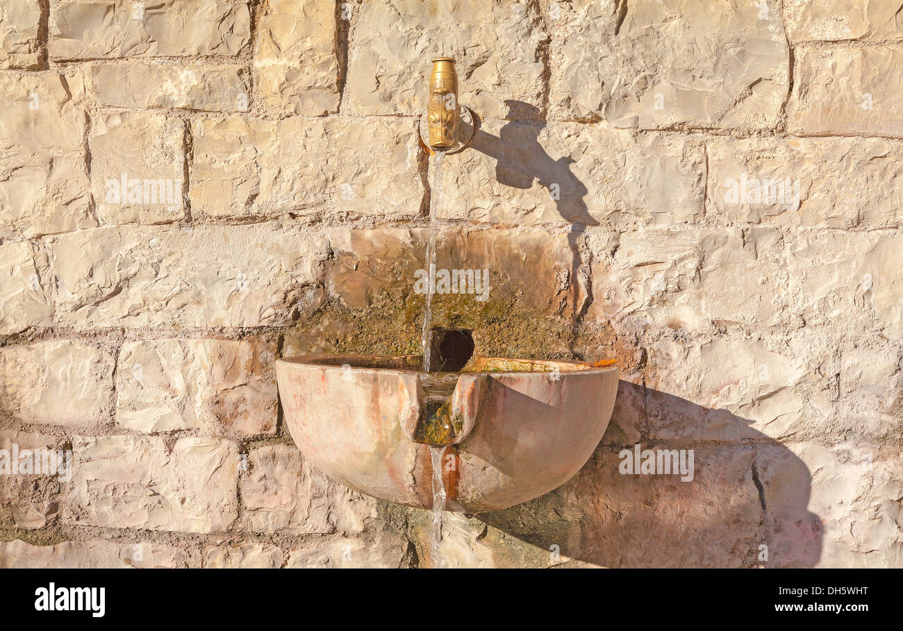 Traditional stone drinking fountain at Olympia Greece Stock Photo - Alamy