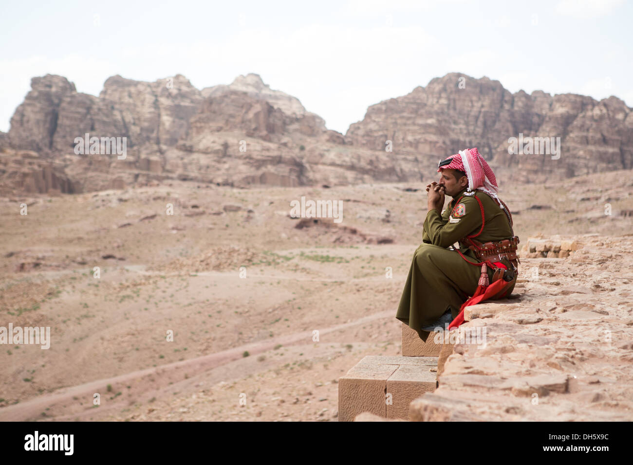 Soldier of the Jordanian Desert Patrol overlooking Petra from a high ...