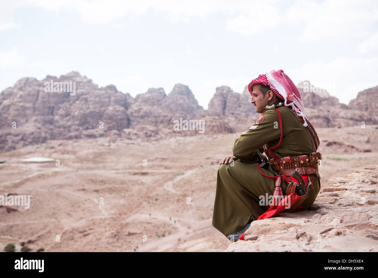 Soldier of the Jordanian Desert Patrol overlooking Petra from a high ...