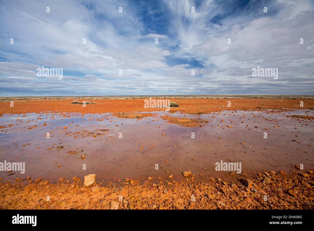 Australian outback plains after rain - pool of water in barren ...