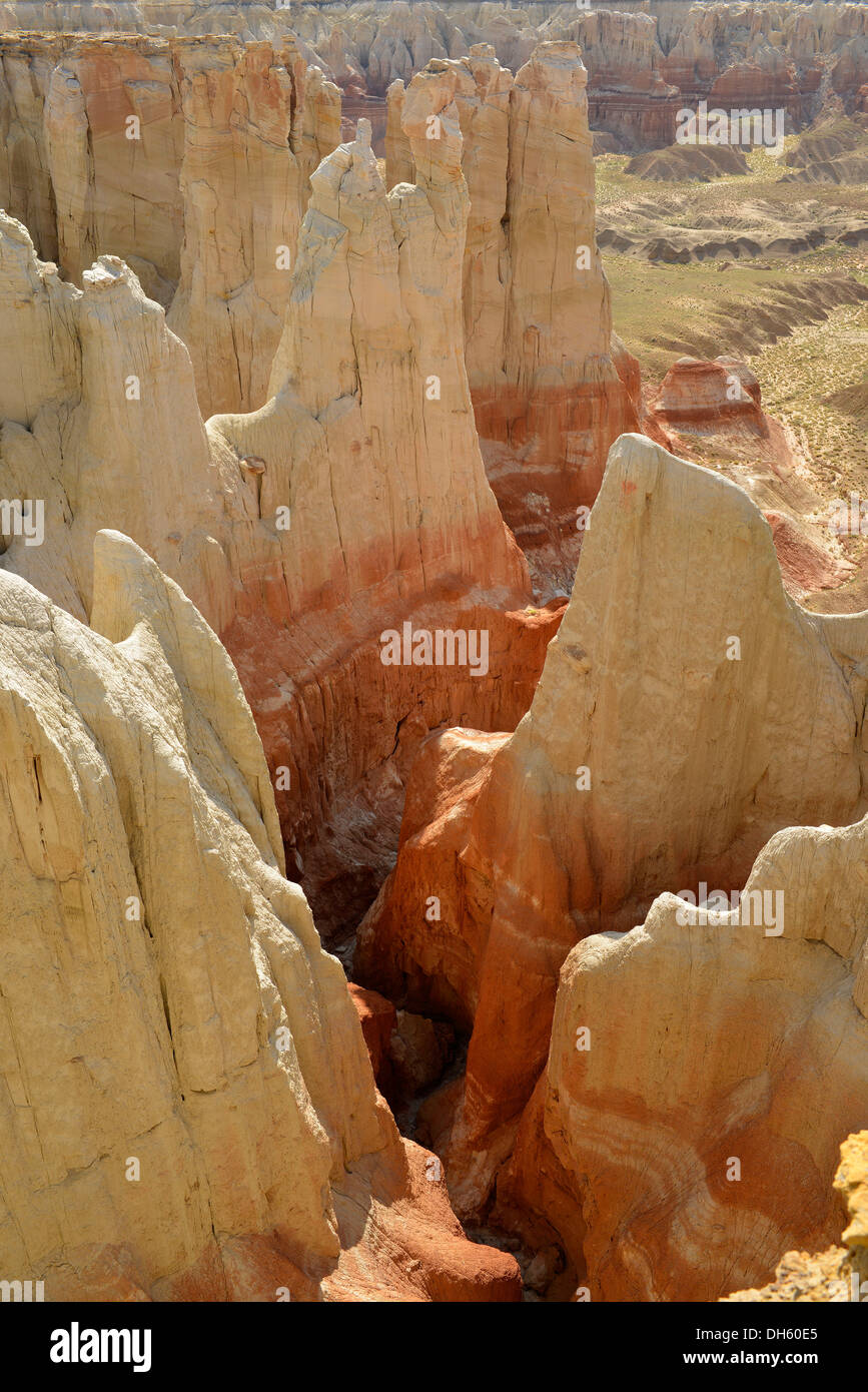 Eroded hoodoos and rock formations discolored by minerals in Ha Ho No ...