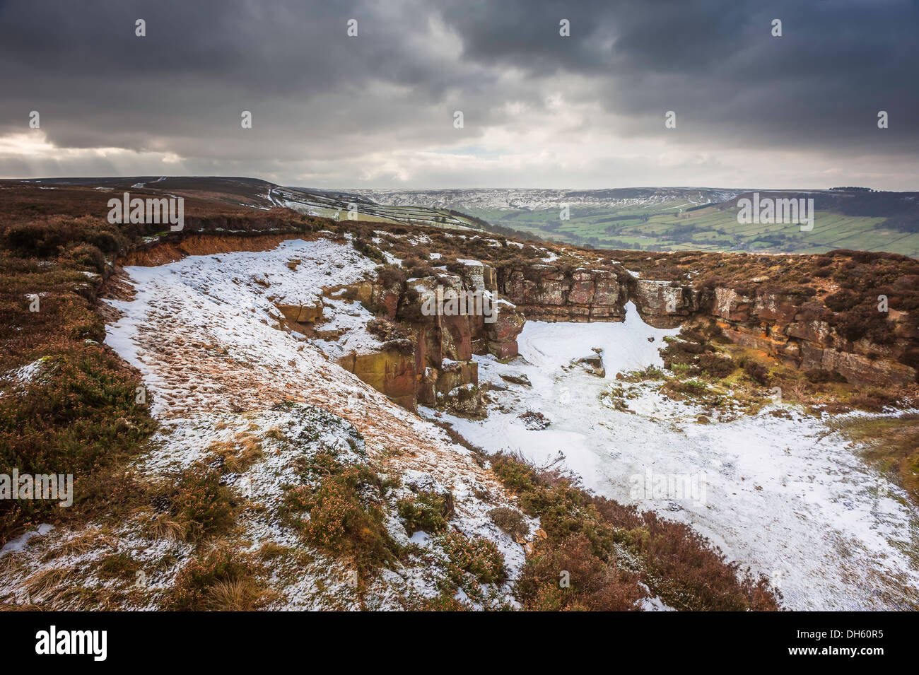 View across a disused stone quarry in winter with Fryup dale in the ...