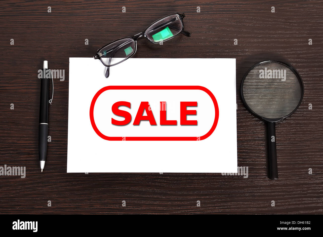 workplace with sale symbol on paper Stock Photo - Alamy