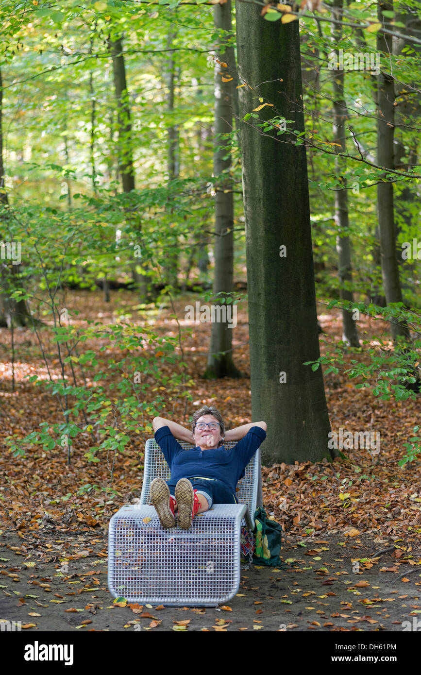 woman relax in autumn forest laying on a chair Stock Photo - Alamy