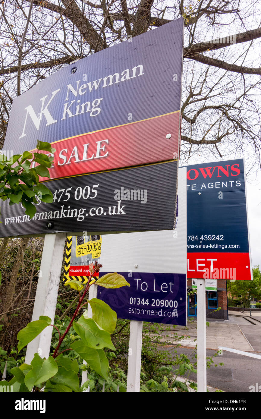 To let and For sale signs by estate agents, UK Stock Photo - Alamy