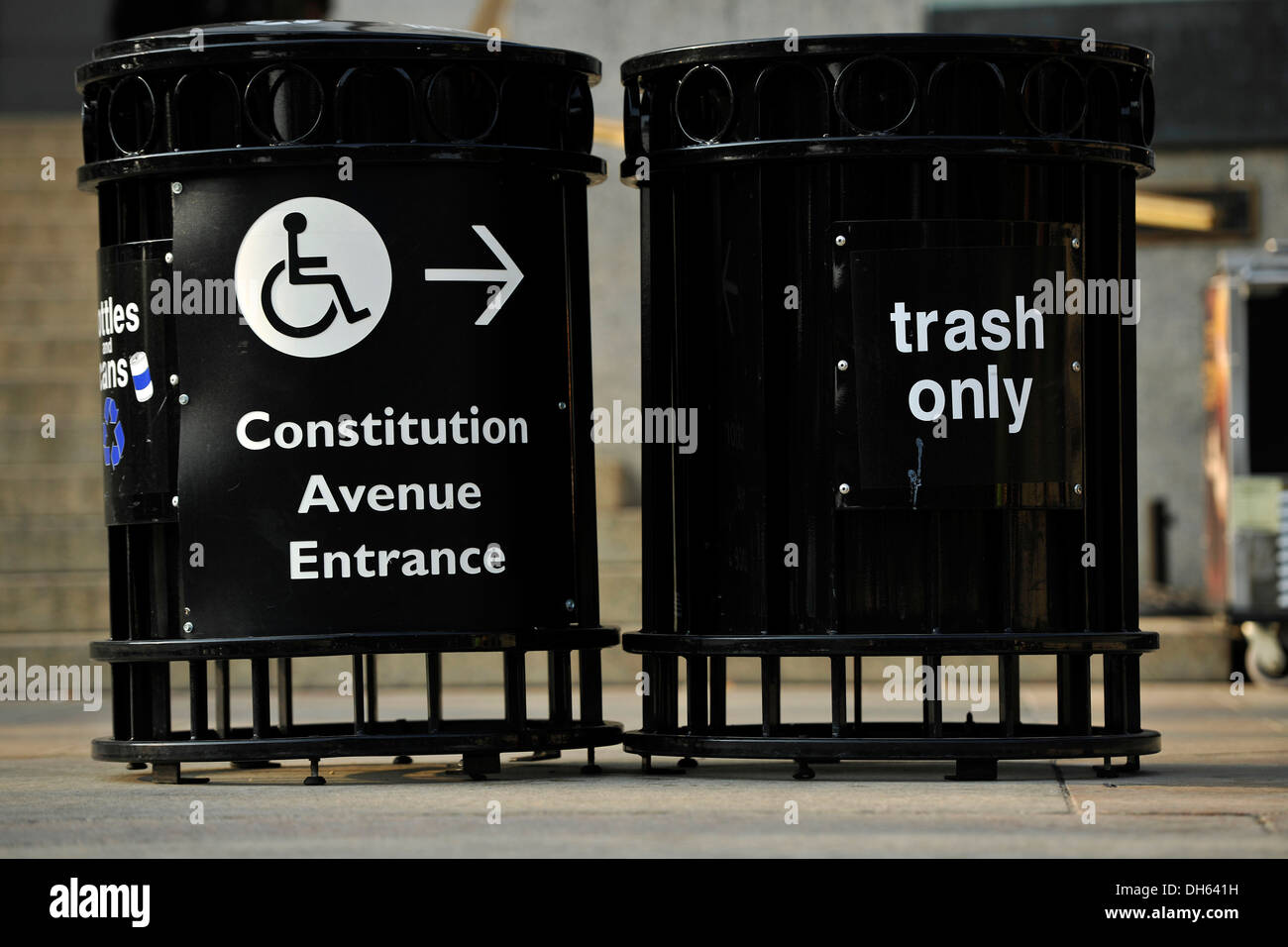 Unfortunate placement of signposts for wheelchair users and trash ...
