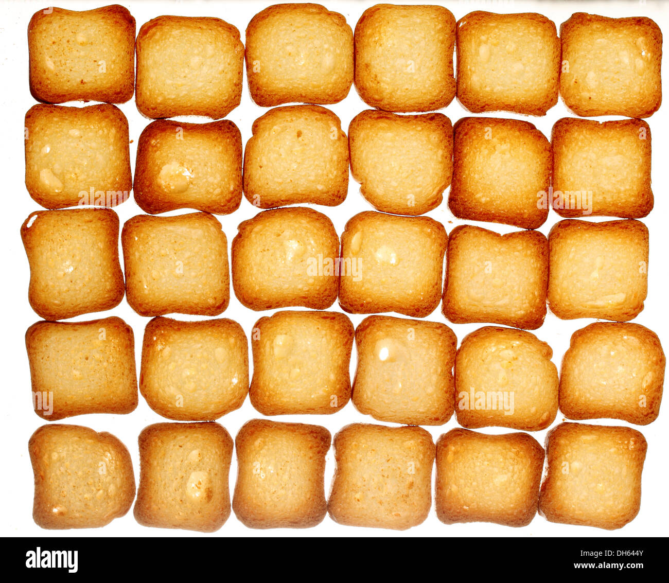 Many small dried rusks bread loaf toast biscuits as texture background ...