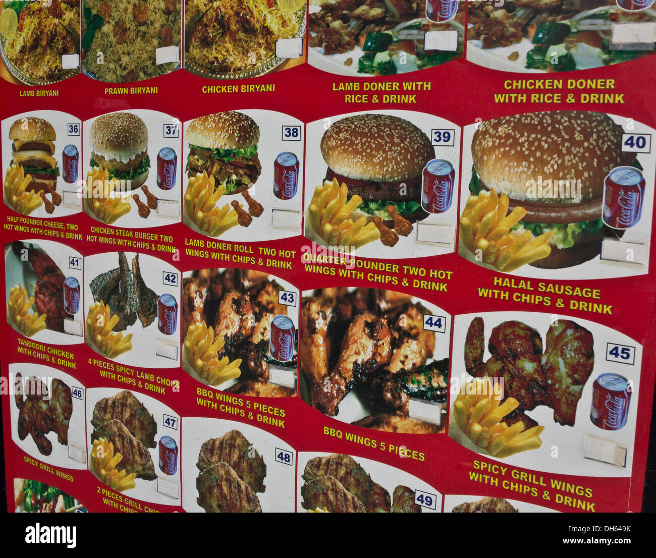 Signs outside a Halal chicken and burger shop in Shadwell London UK ...