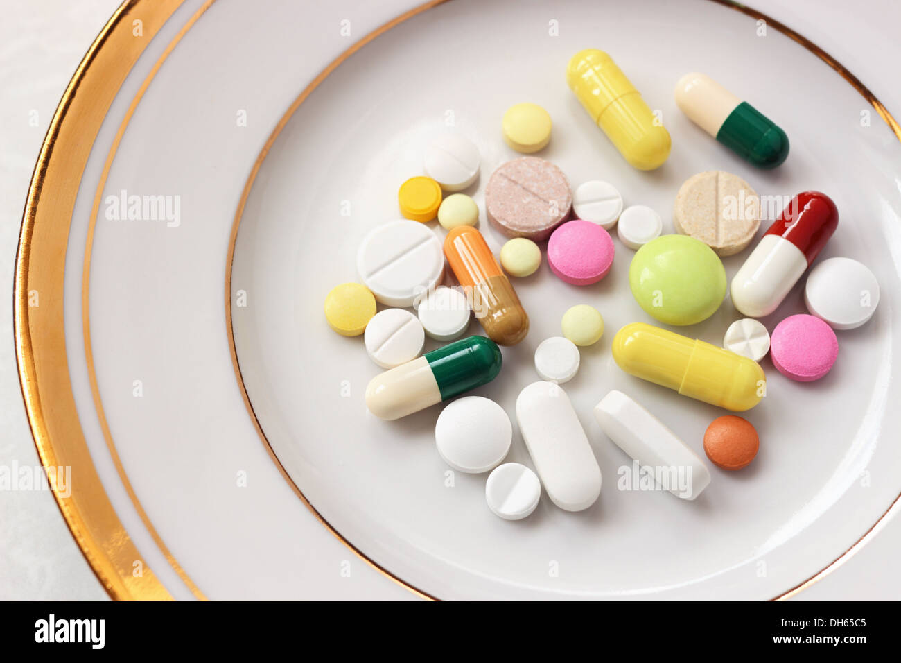 Medicine on china plate Stock Photo - Alamy