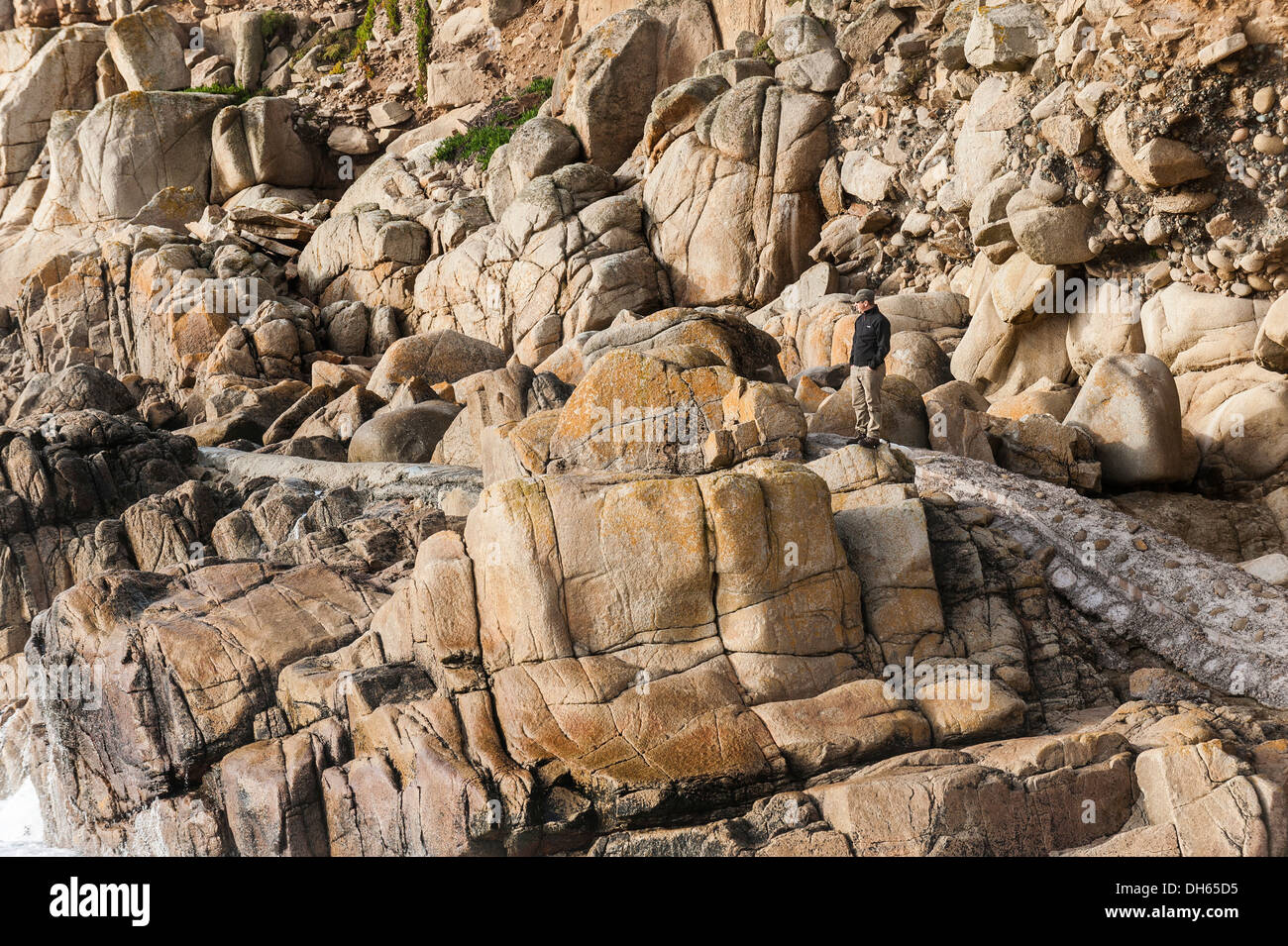 Man standing on the rocks hi-res stock photography and images - Alamy