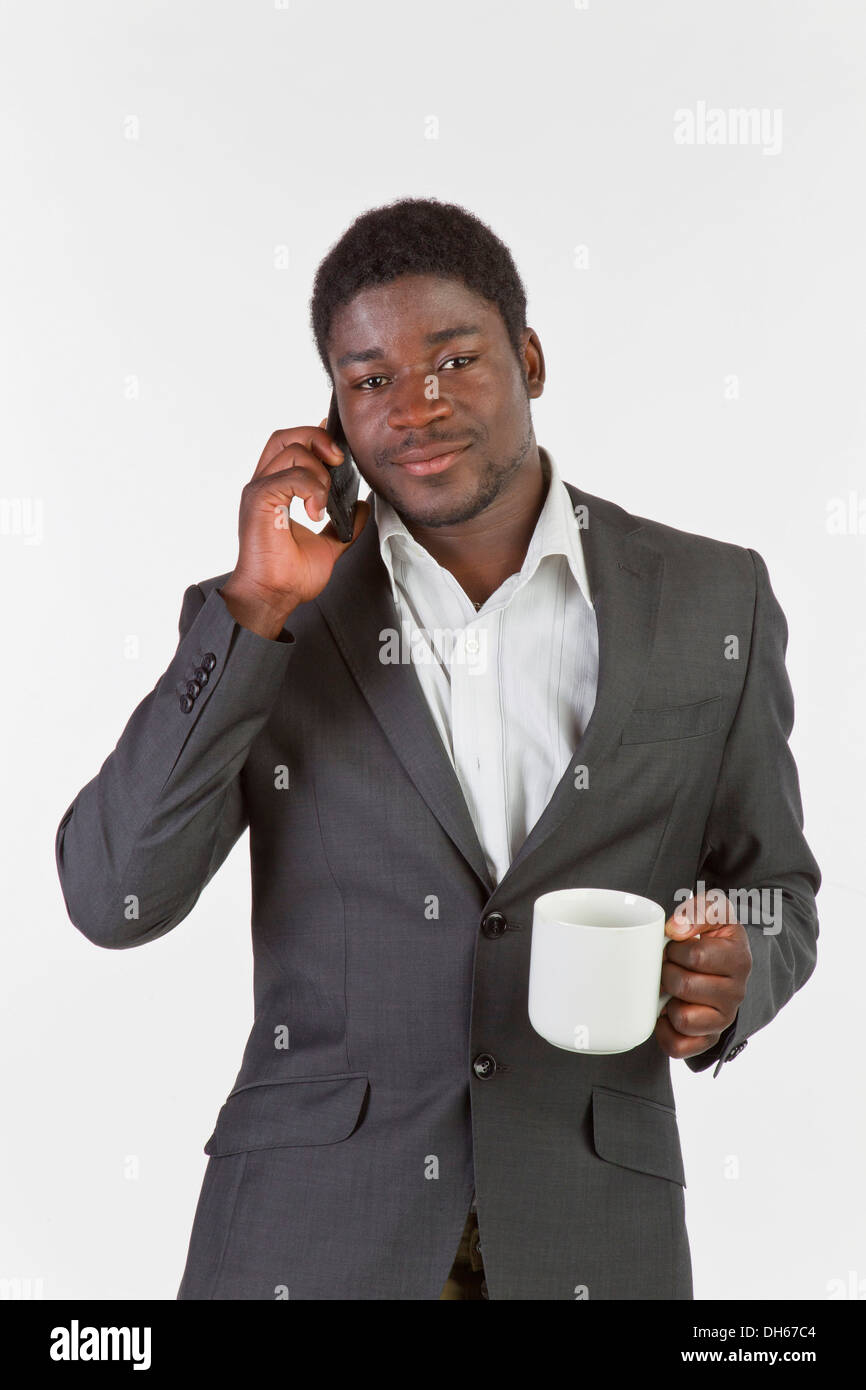 Young black man using a mobile phone Stock Photo - Alamy