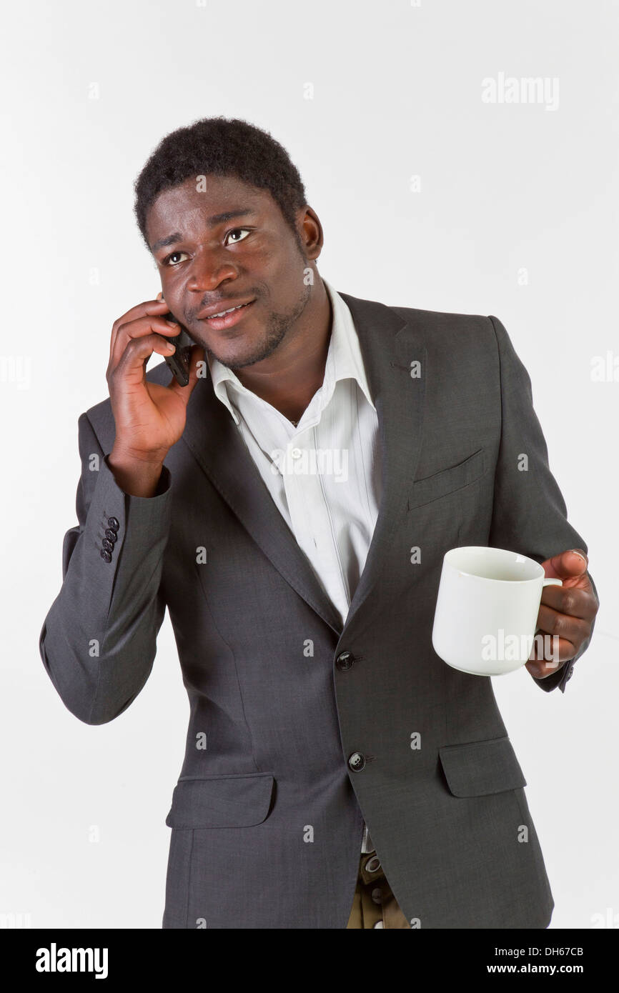 Young black man using a mobile phone Stock Photo - Alamy