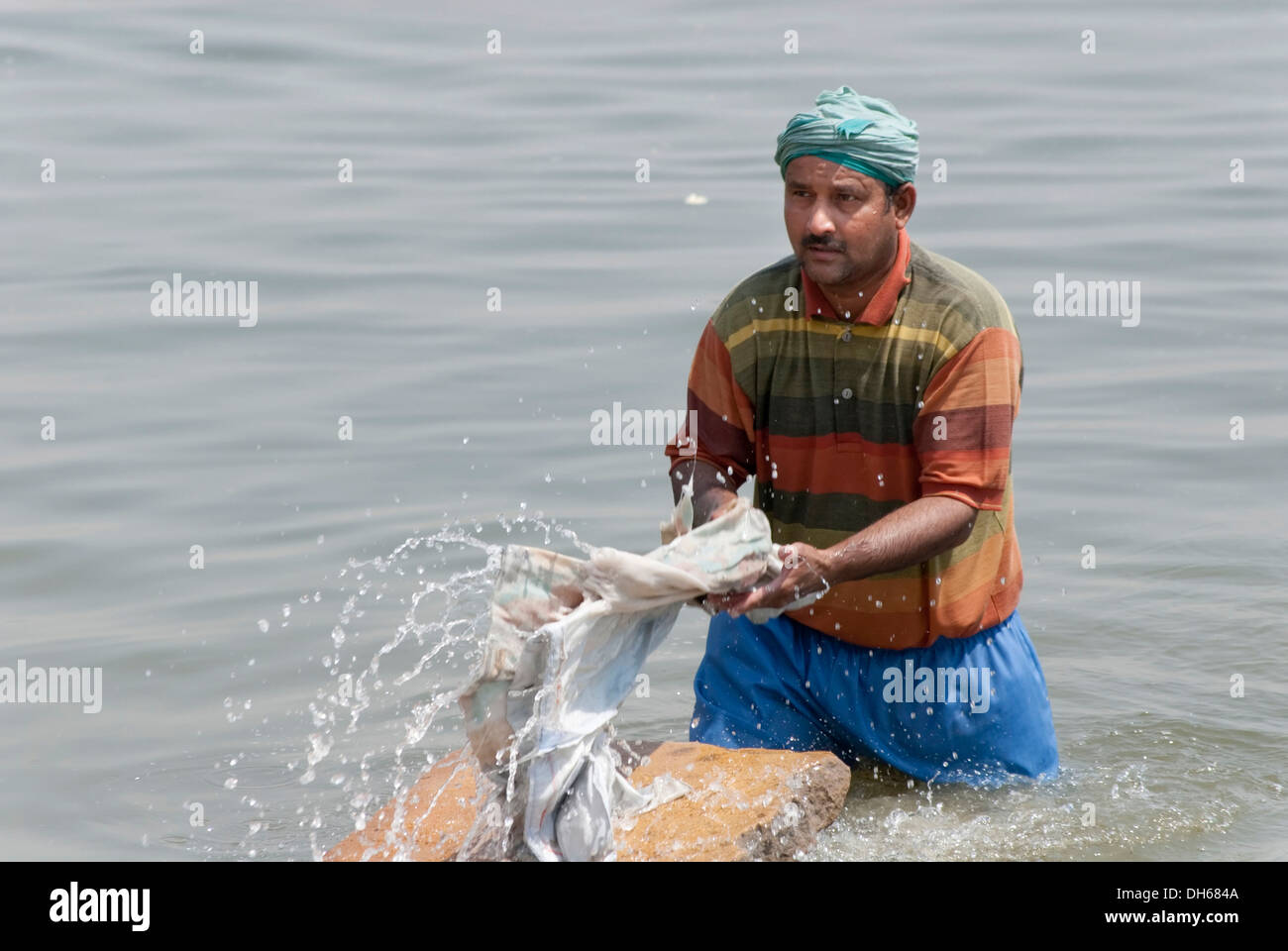 Indian man doing his laundry, Ganges River, Varanasi, India, Asia Stock ...