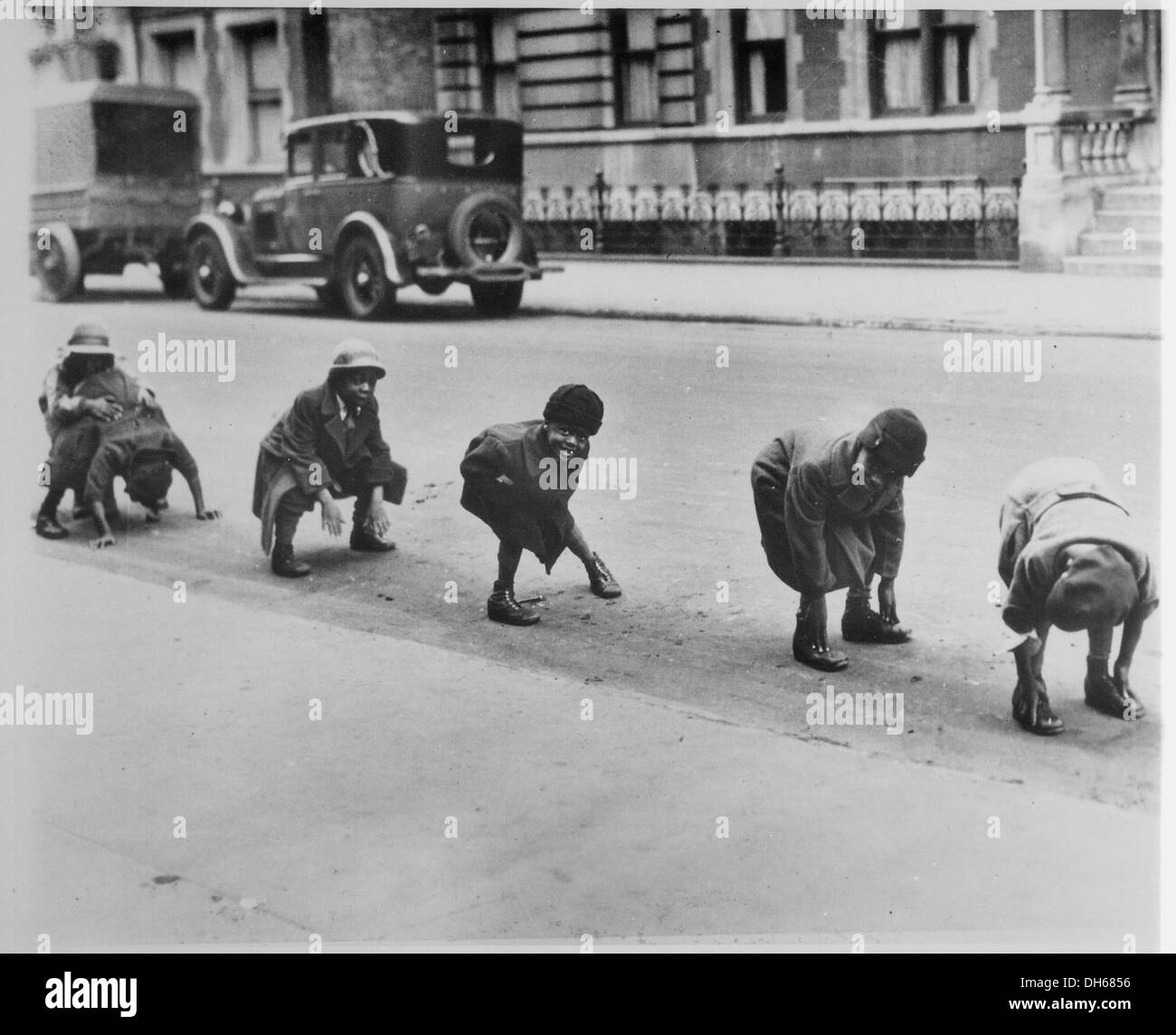 Black children playing leap frog in a harlem street hi-res stock ...