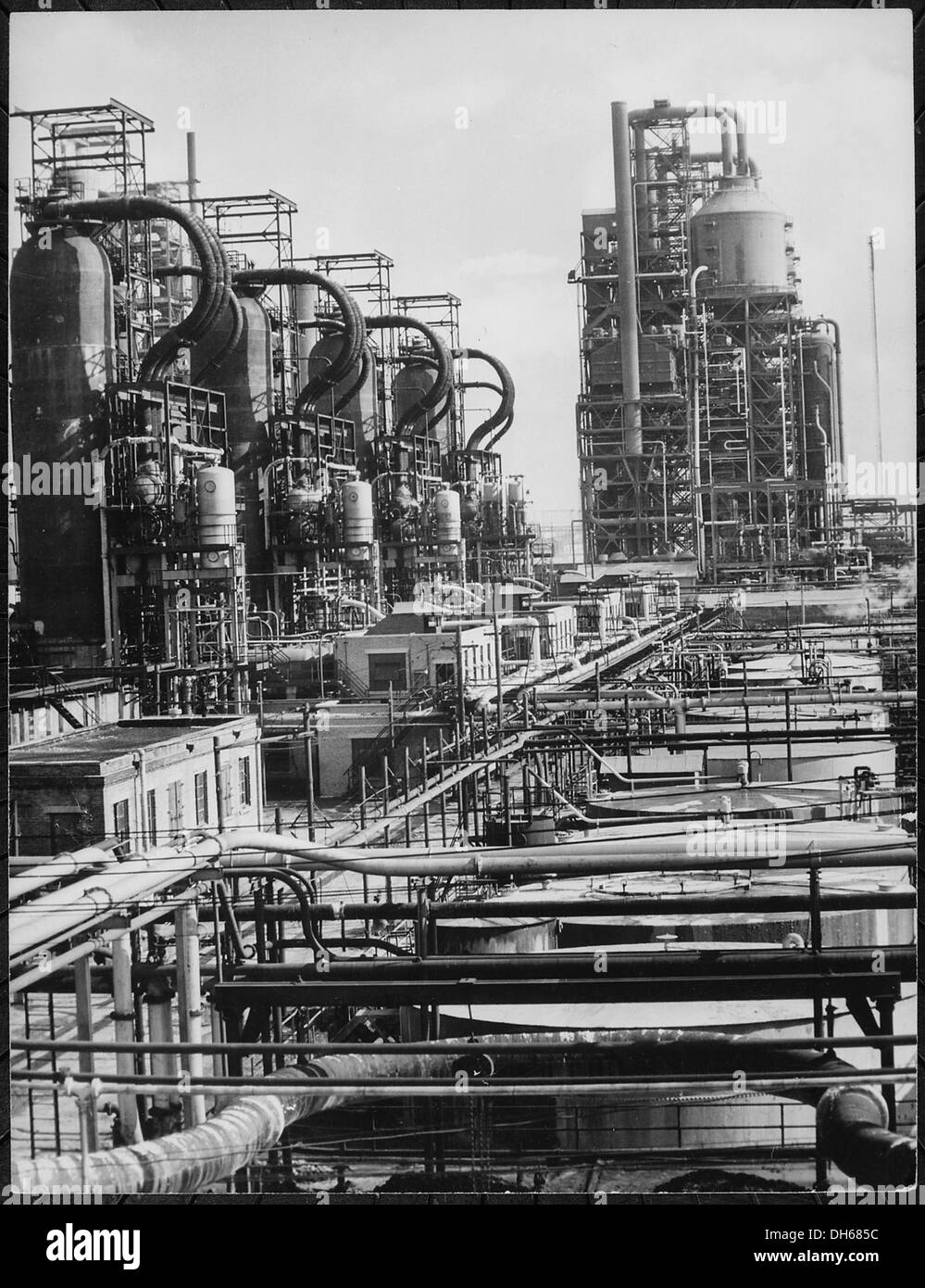 The Baton Rouge Esso Refinery, captured around 1945, showing crude-oil ...