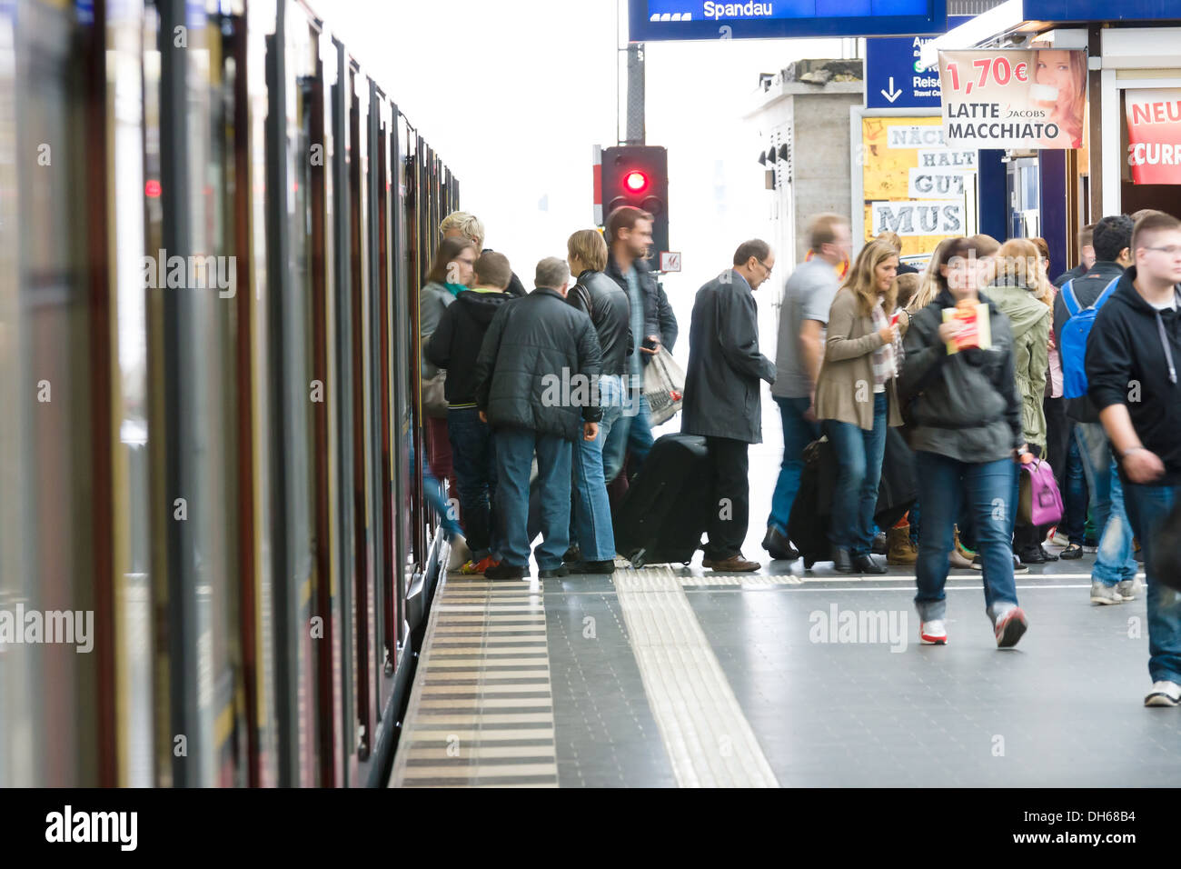 Passengers leave the train at the railway station platform. Berlin ...