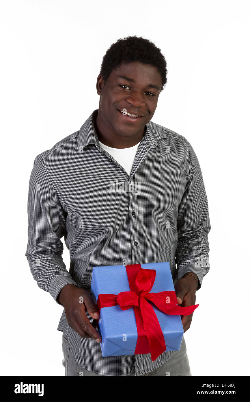 Young black man holding a present Stock Photo - Alamy