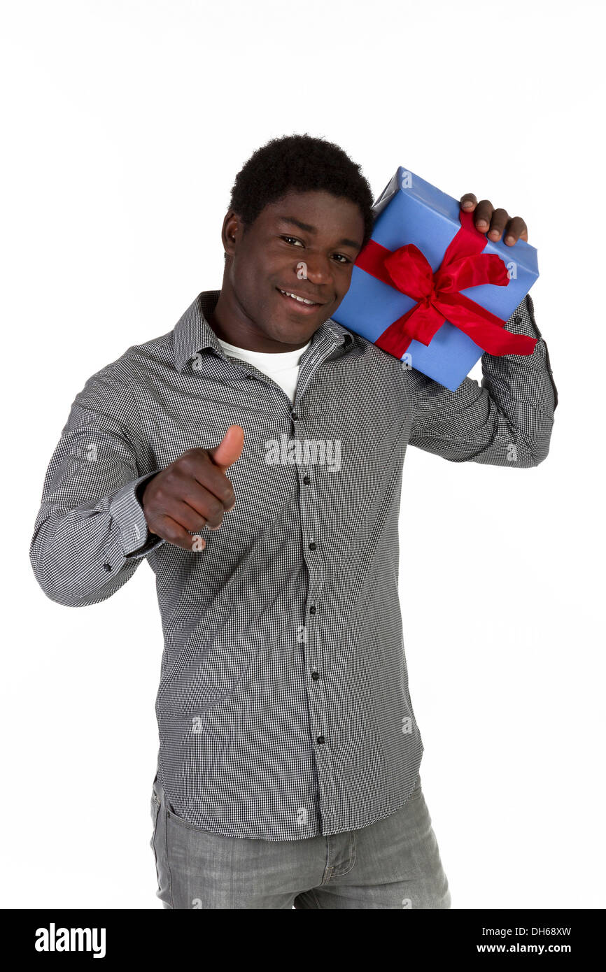 Young black man holding a present Stock Photo - Alamy