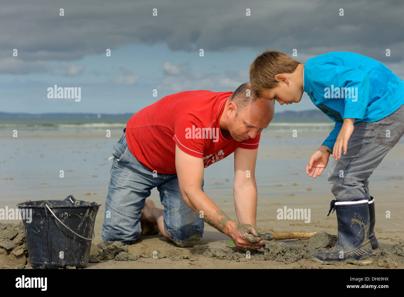 Man Digging For Worms On The Beach High Resolution Stock Photography ...