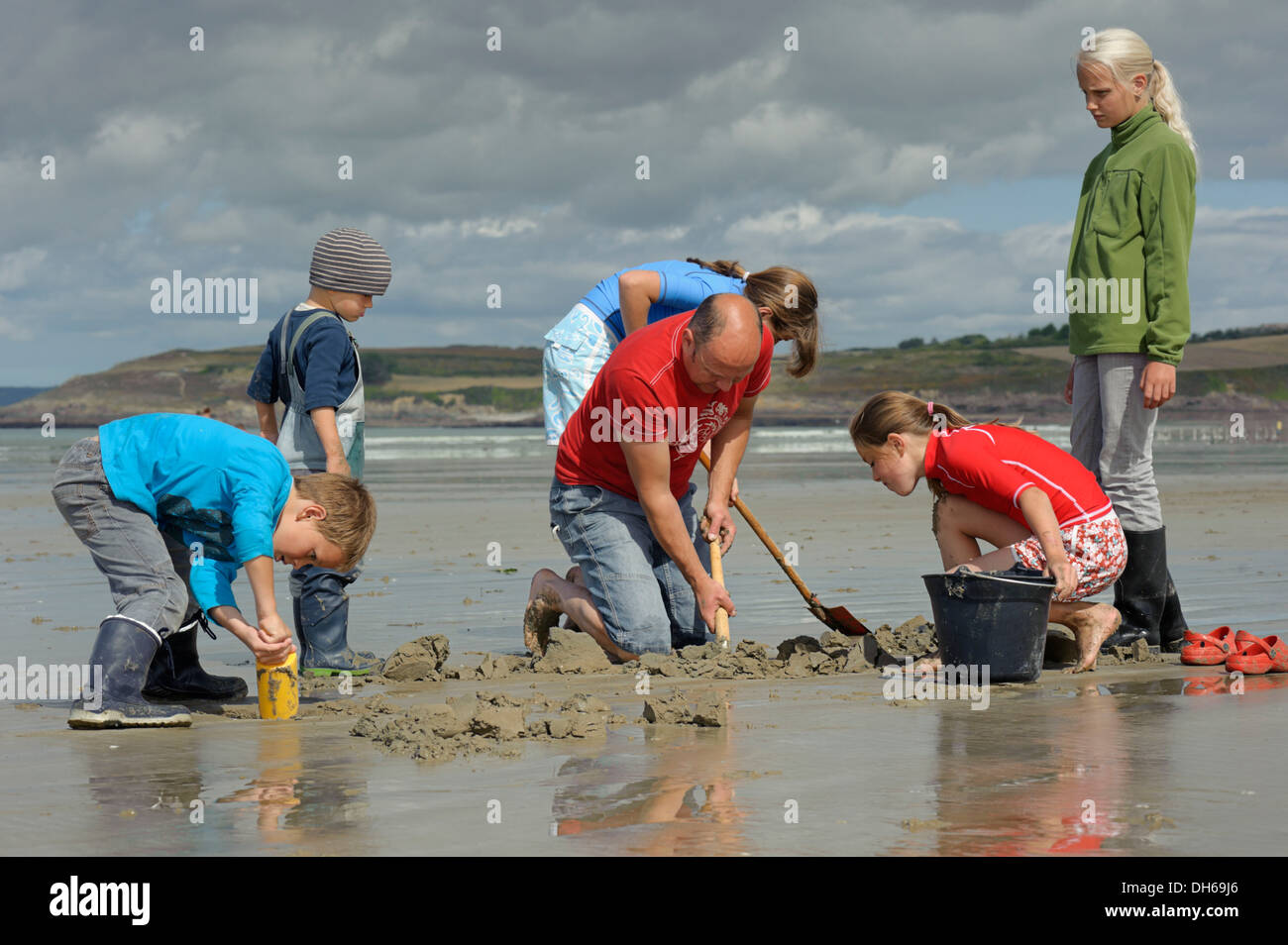 Man Digging For Worms On The Beach High Resolution Stock Photography ...