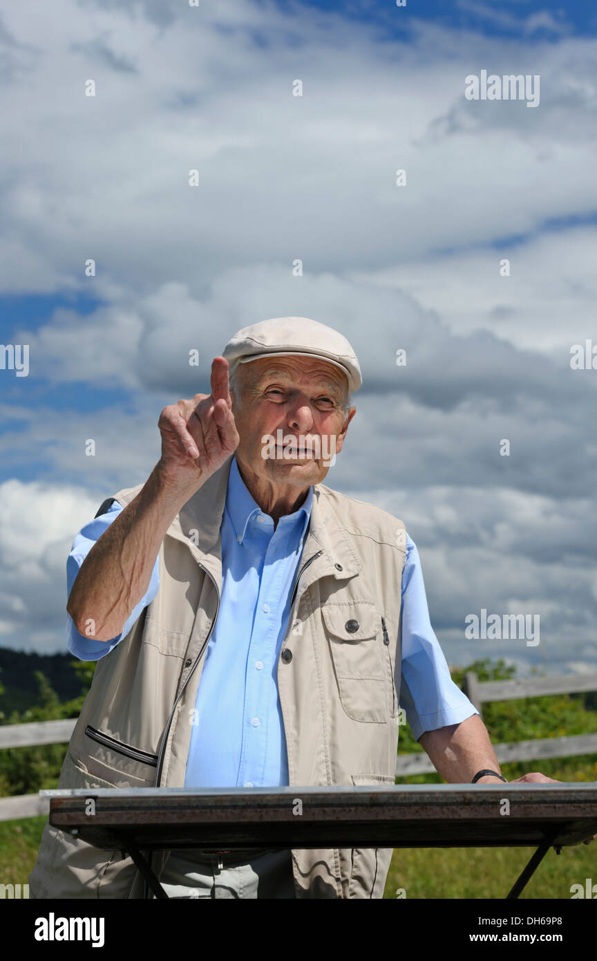 Old man studying an information board in the countryside, PublicGround ...