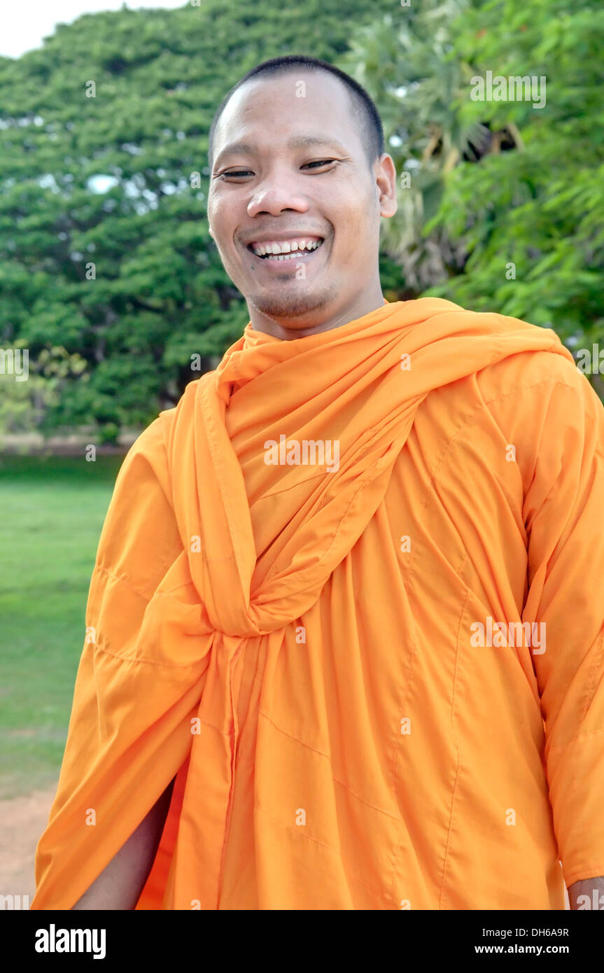 Monk Wearing An Orange Robe Smiling Angkor Wat Complex Siem Reap