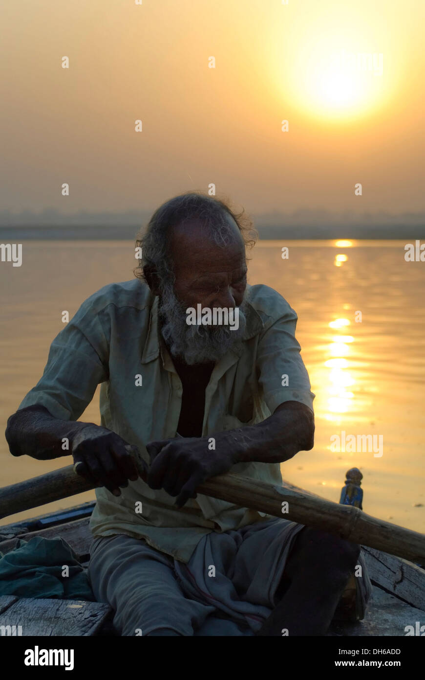 Old man rowing boat hi-res stock photography and images - Alamy