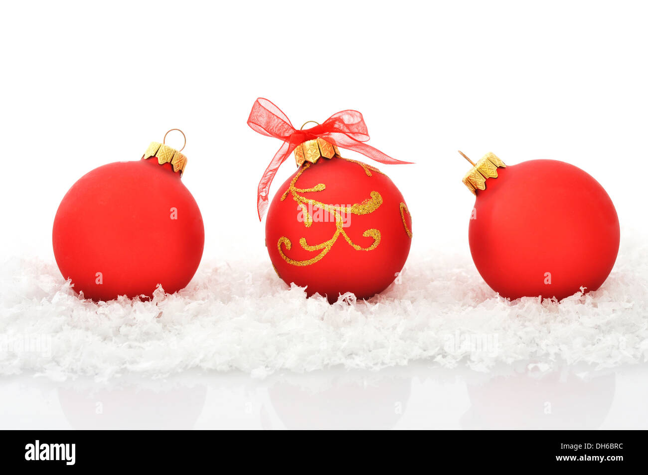Red christmas balls in row and snow isolated on white Stock Photo - Alamy
