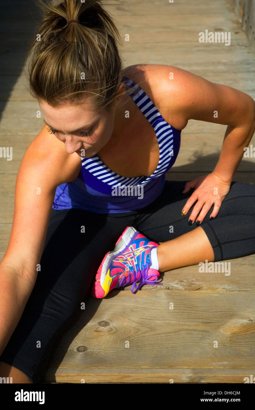 Seated hamstring stretch Stock Photo - Alamy
