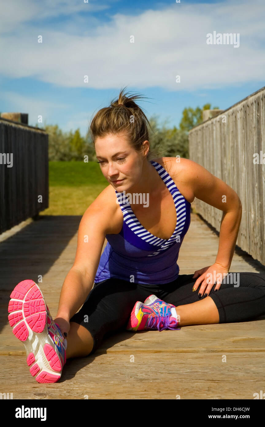Seated hamstring stretch Stock Photo - Alamy