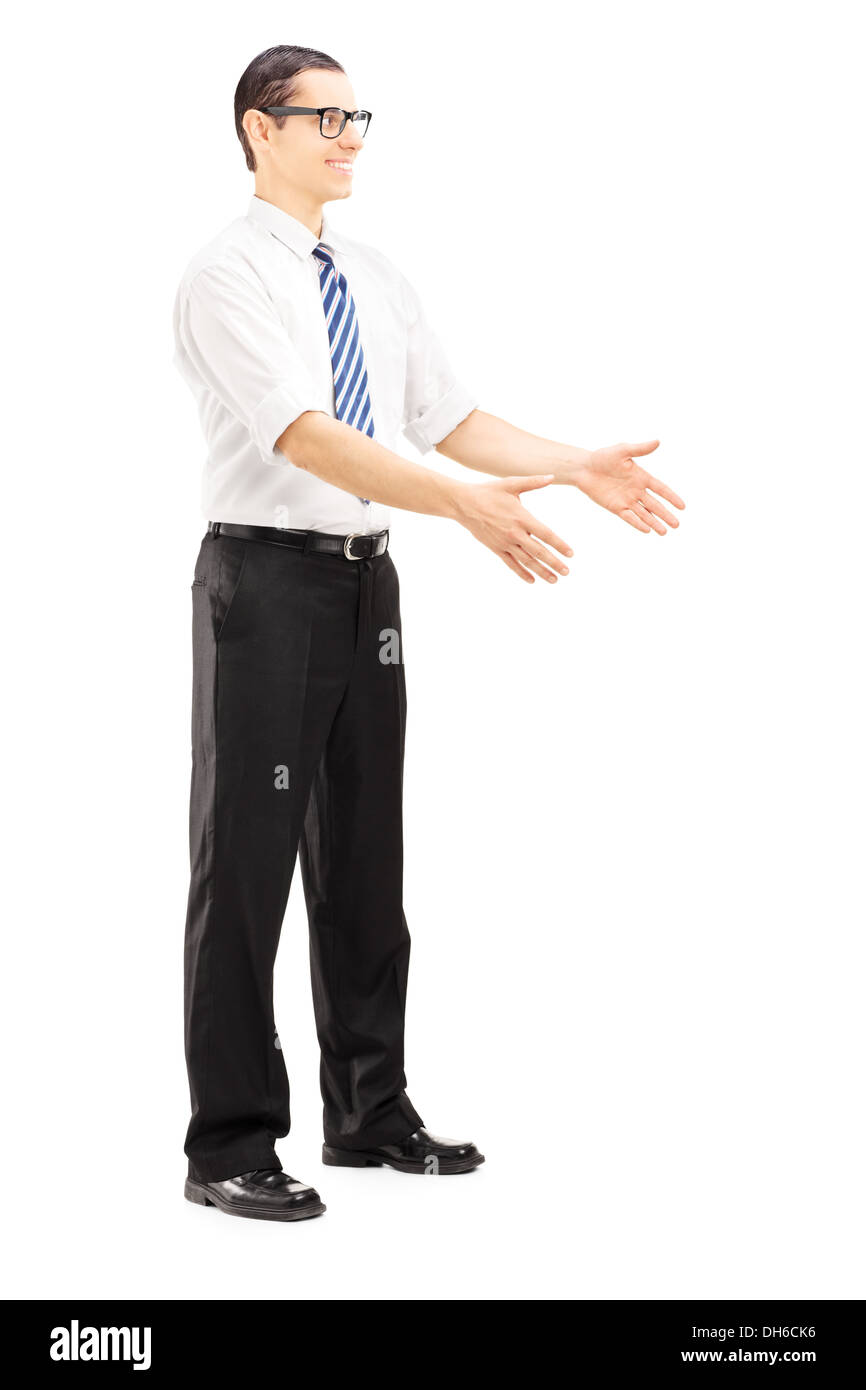 Full length portrait of a smiling young man about to take something ...