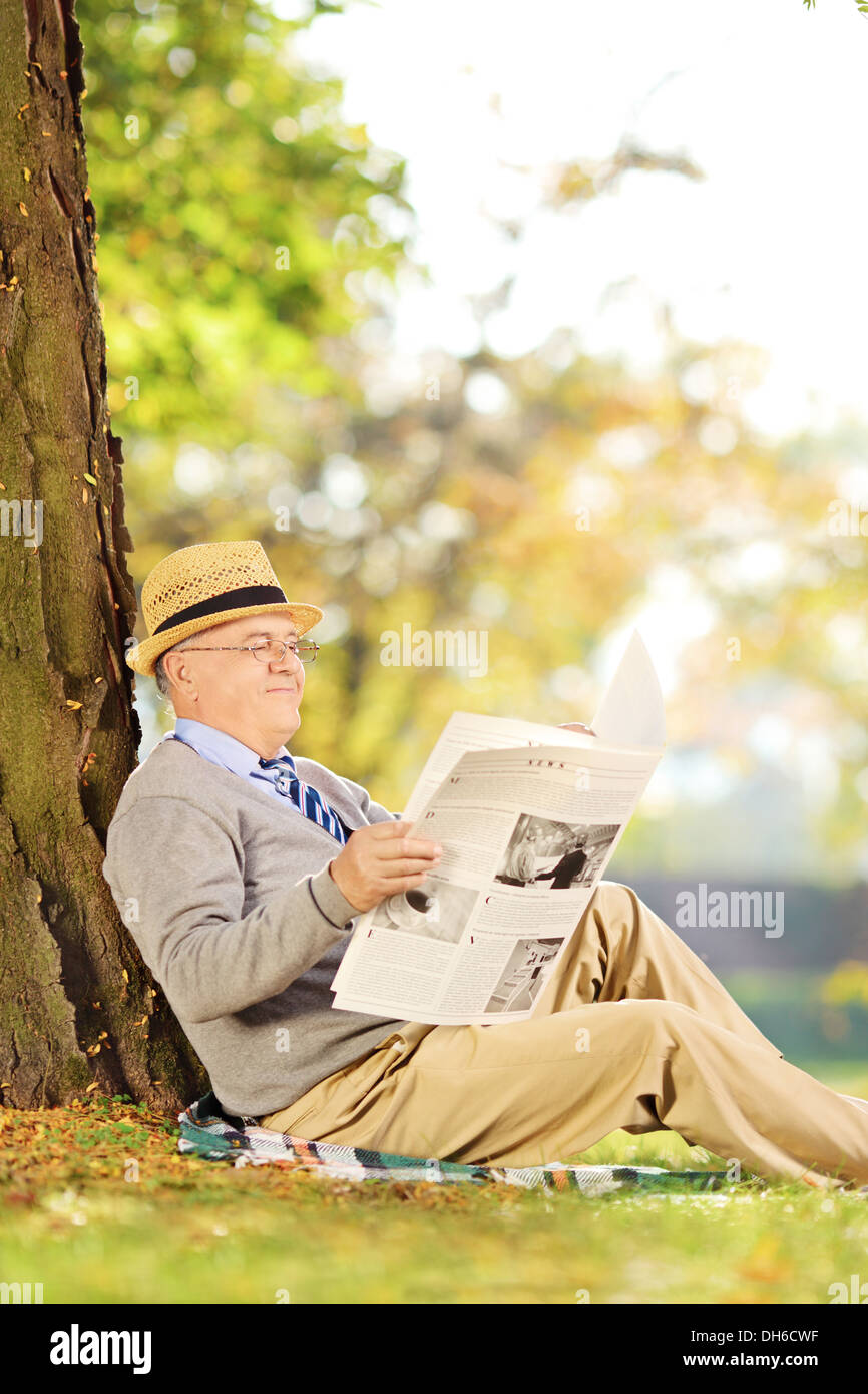 Reading A Newspaper In The Park High Resolution Stock Photography and ...