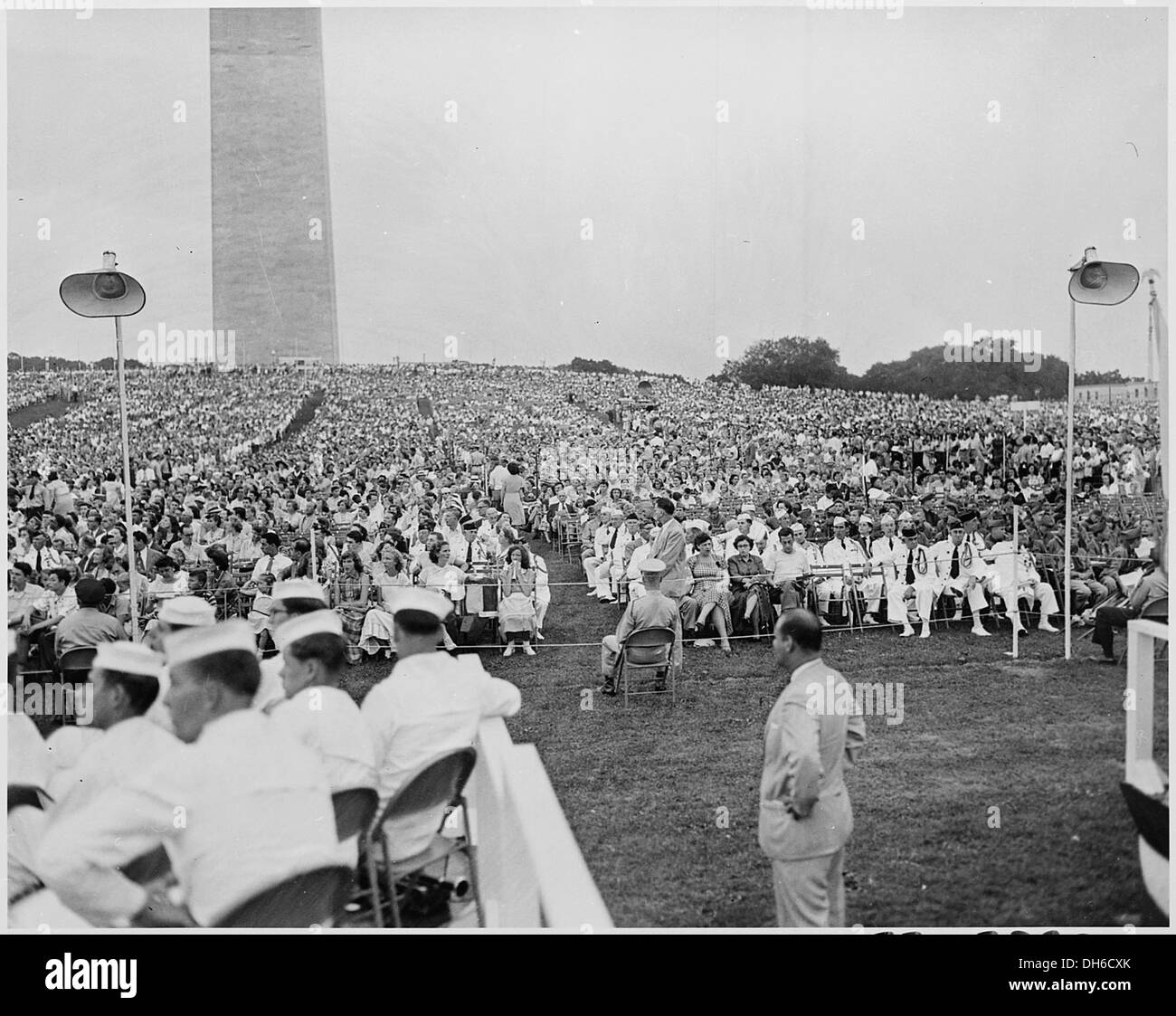 This image shows a large crowd gathered at the Washington Monument in ...