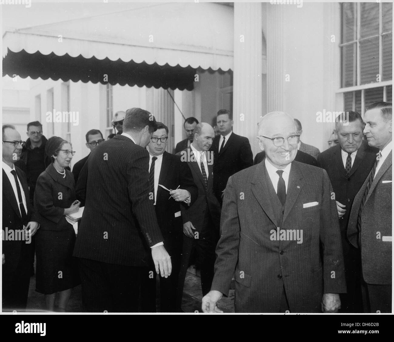 This photograph shows former President Harry S. Truman smiling during ...