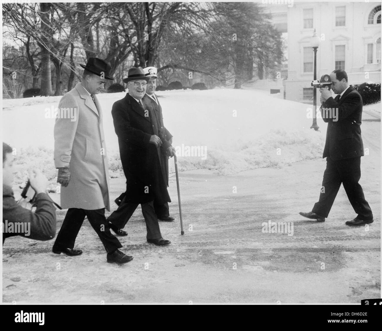 A historic photograph captures former President Harry S. Truman walking ...