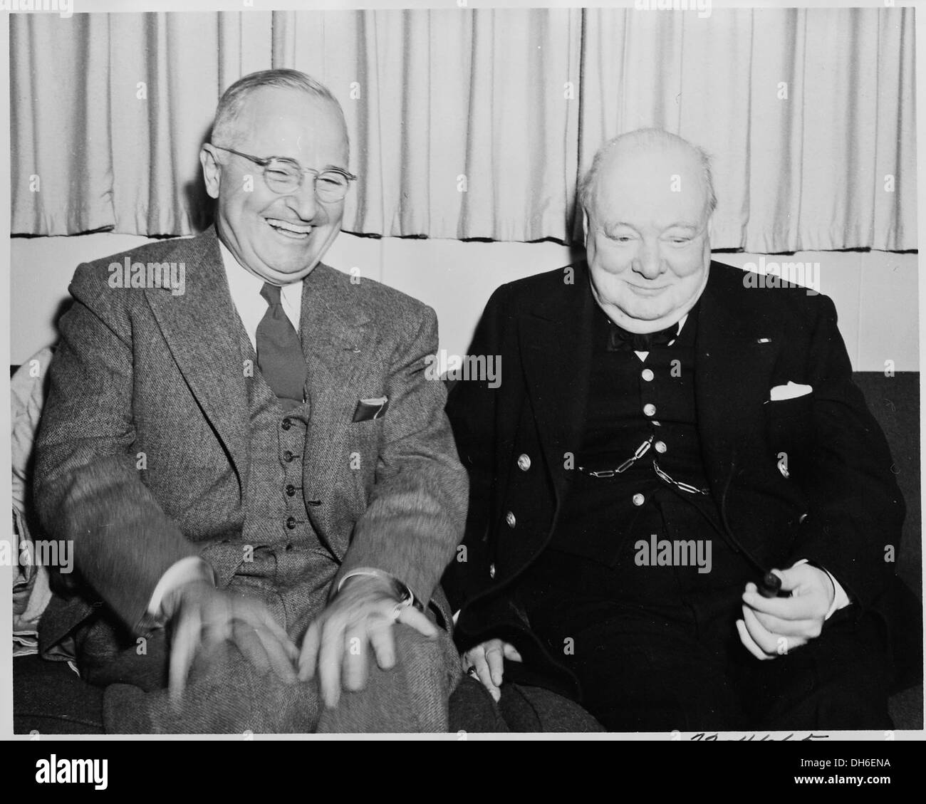 This photograph captures President Harry S. Truman laughing with ...