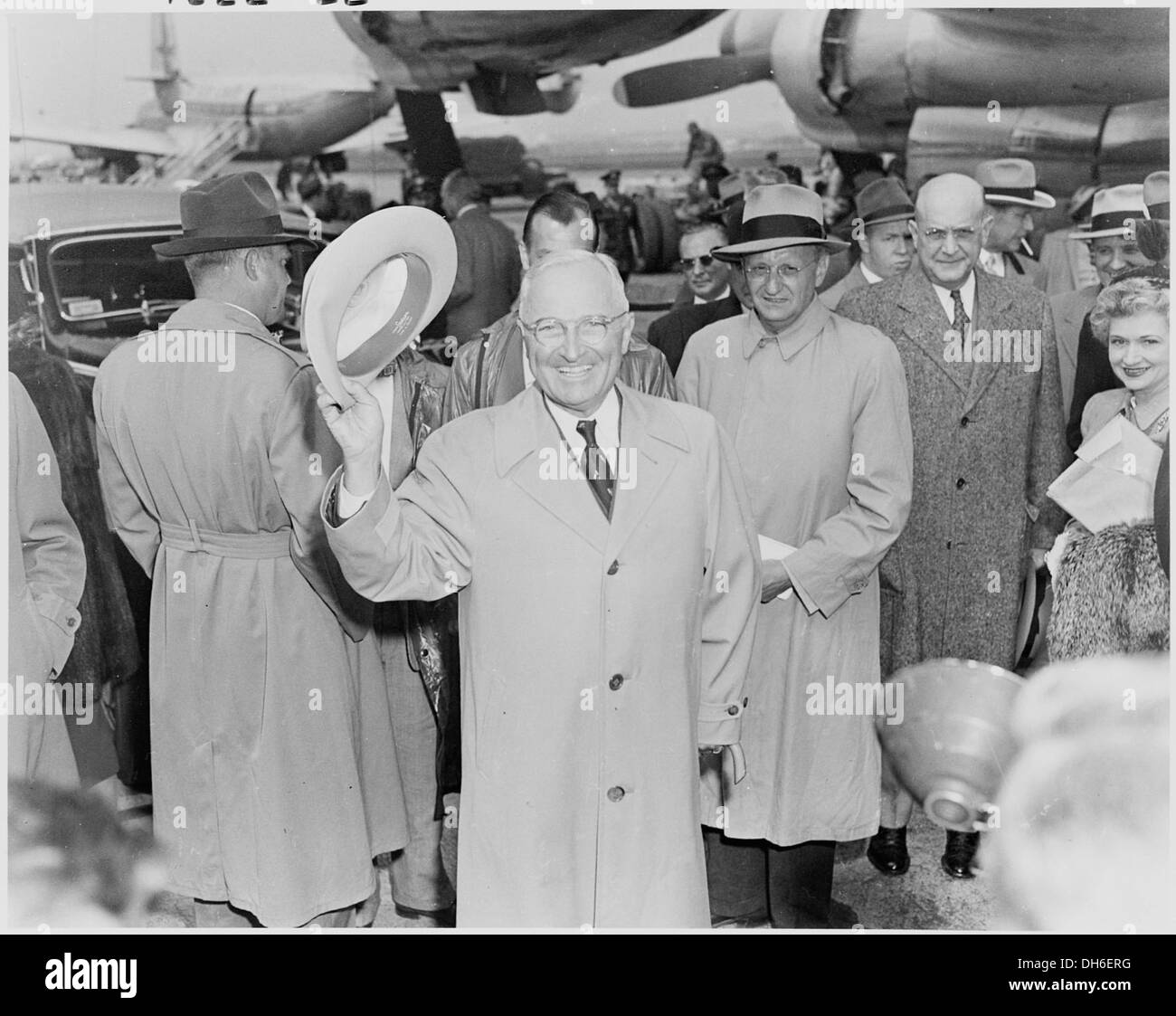 President Harry S. Truman is captured waving to photographers upon his ...