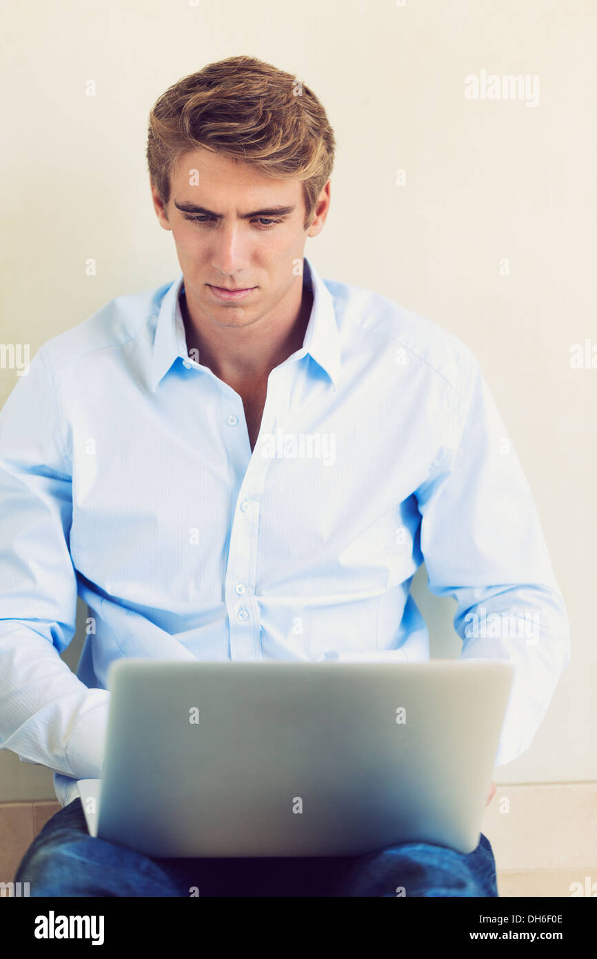 Young professional male working hi-res stock photography and images - Alamy